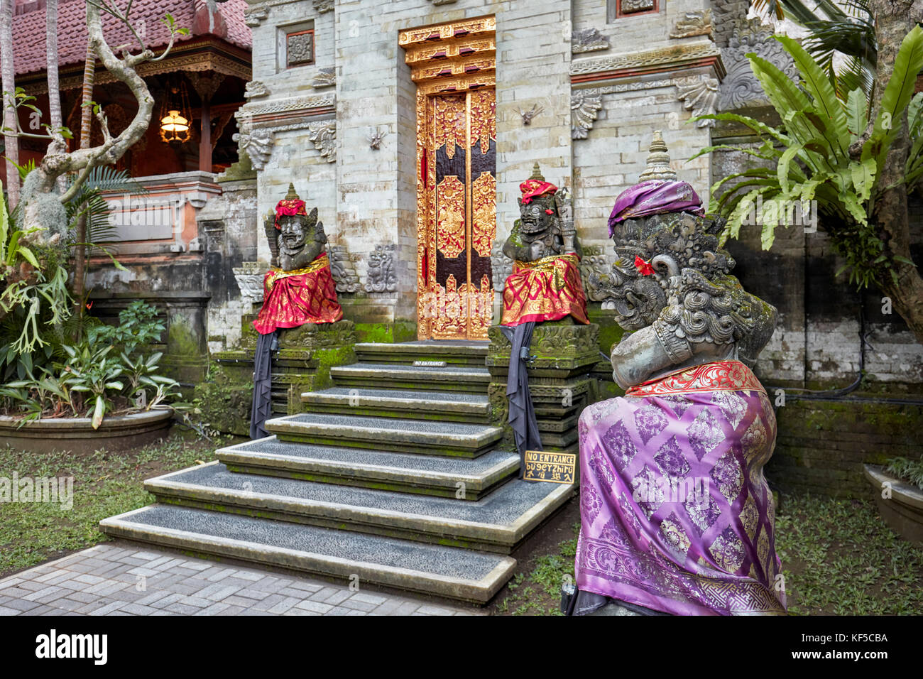 Carved stone statues in Puri Saren Agung, also known as Ubud Palace ...