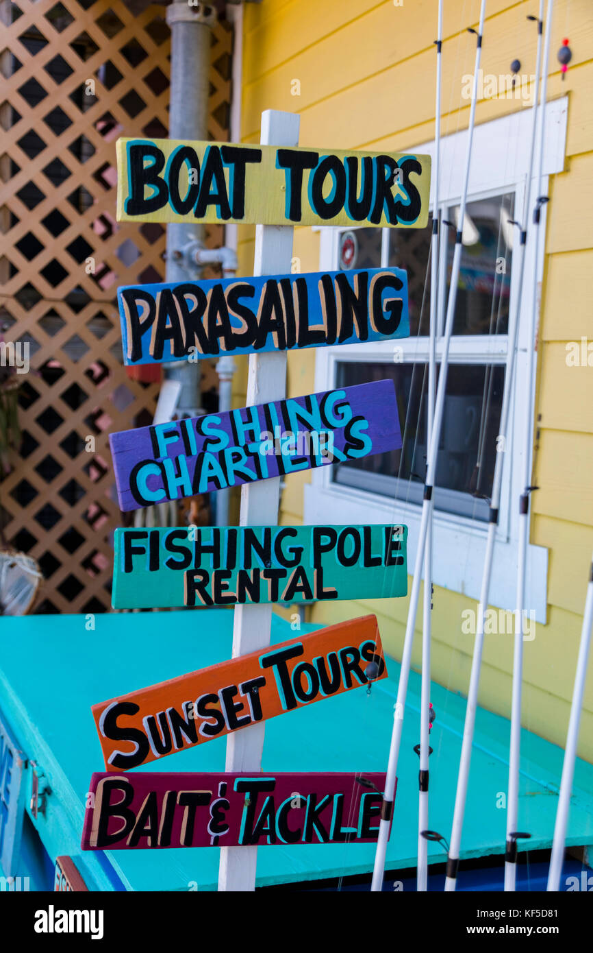 Hand crafted tourist direction signs in Bradenton Beach on Anna Maria ...