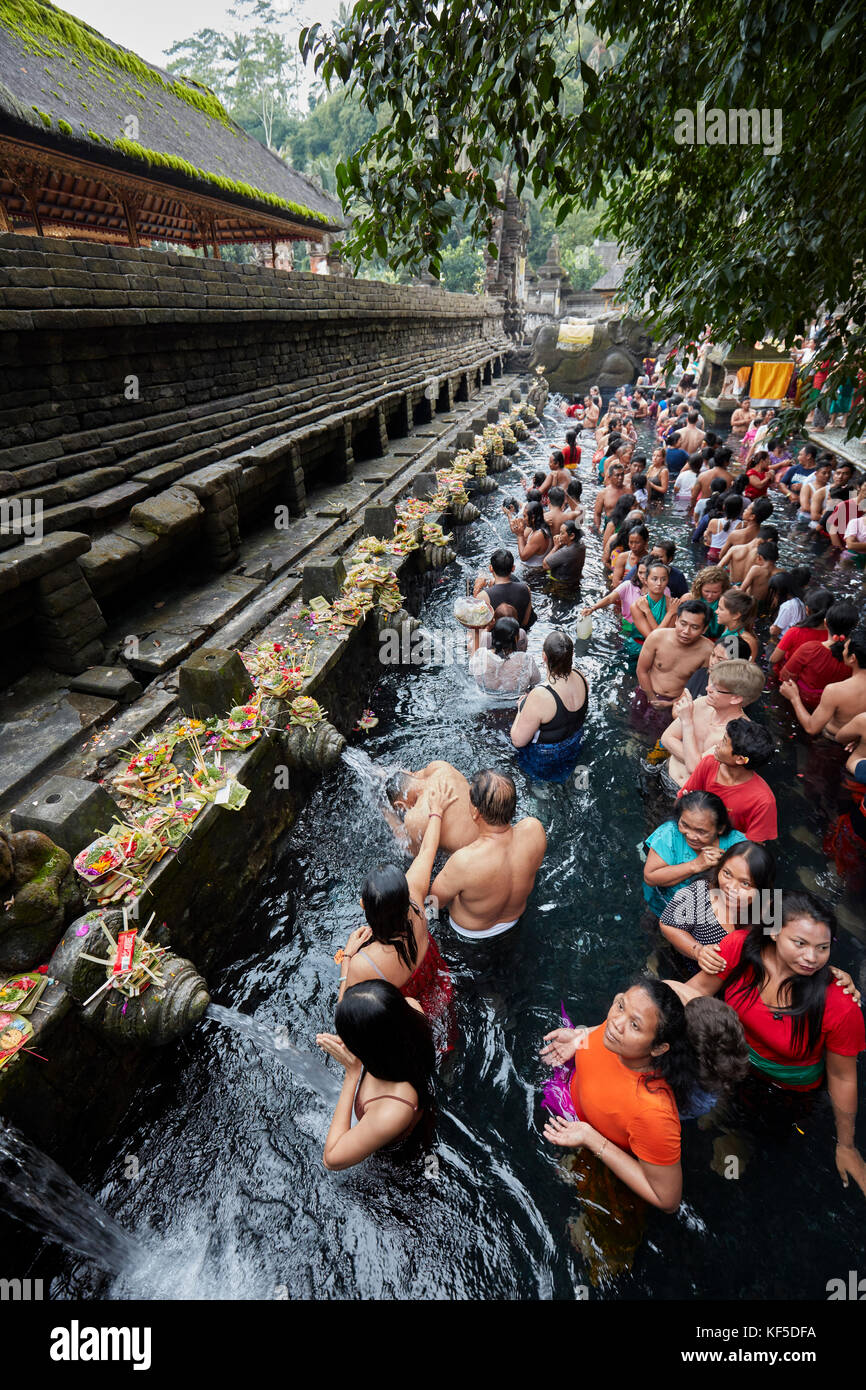 People waiting in line to make ritual purification in the holy spring ...