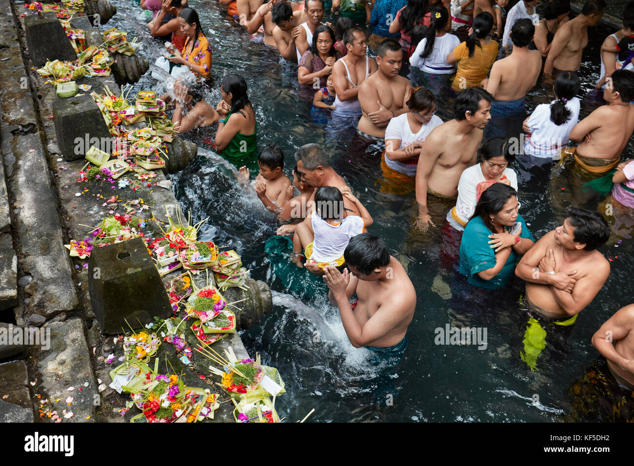 People waiting in line to make ritual purification in the holy spring ...