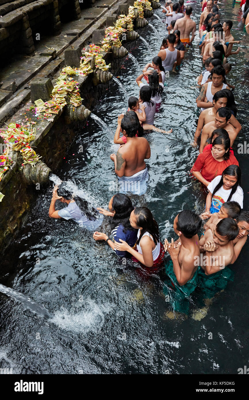 People waiting in line to make ritual purification in the holy spring ...