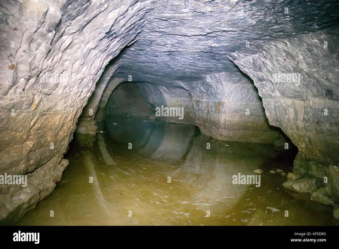 partially flooded underground caves catacomb. journey underground ...