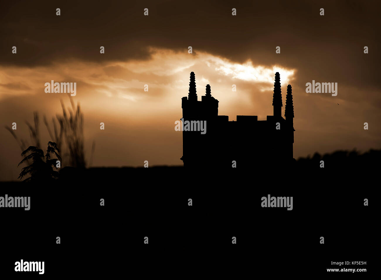 Old church silhouette during misty morning sunrise in Wiltshire ...
