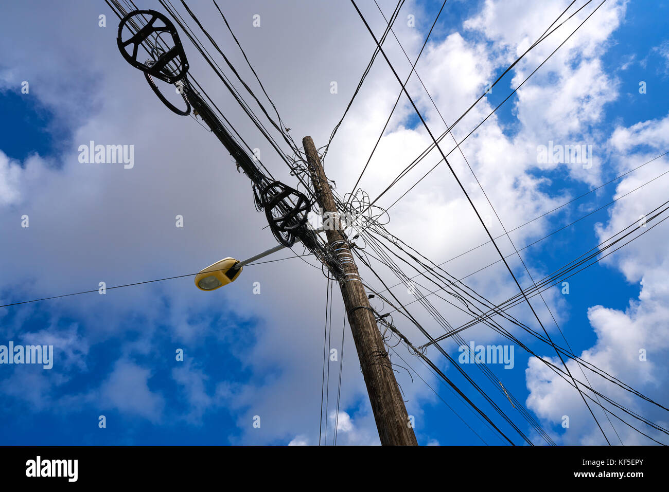 Messy electric aerial wires and pole in Mexico Stock Photo - Alamy