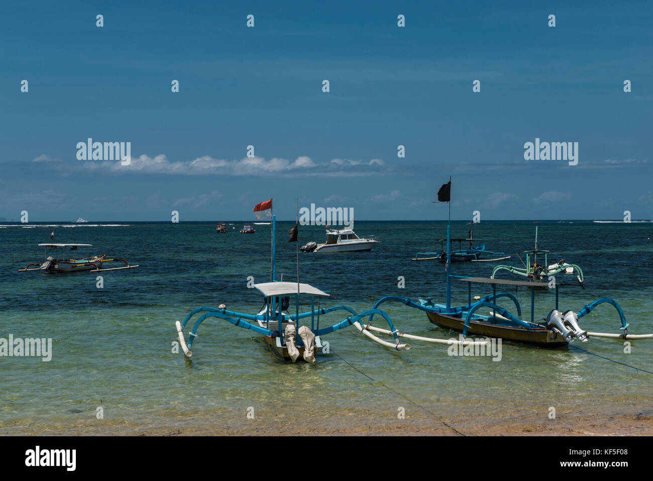 Traditional balinese dragonfly boat on the beach. Jukung fishing boats ...