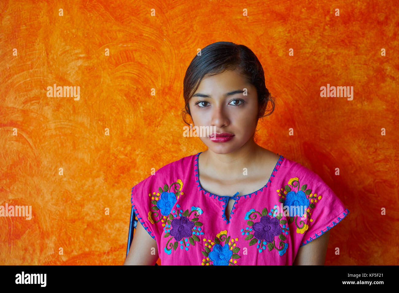 Mexican woman with mayan dress latin ethnicity on orange background ...