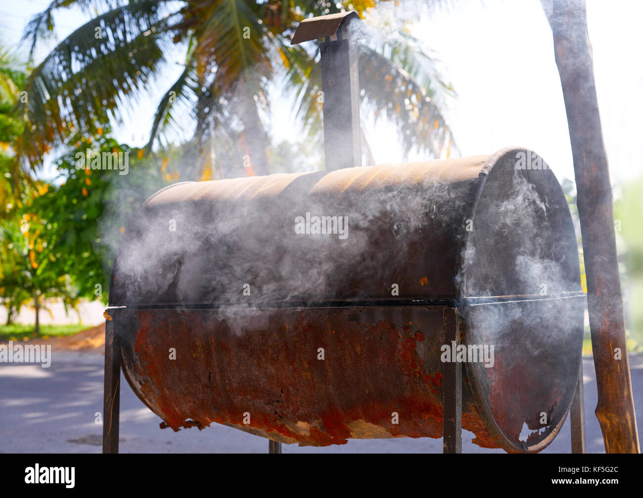 Aged rusted iron barrel barbecue in Mexico Riviera Maya Stock Photo - Alamy