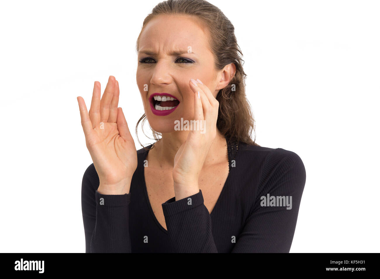 Brave woman is screaming. She has green eyes and blond hair, black ...