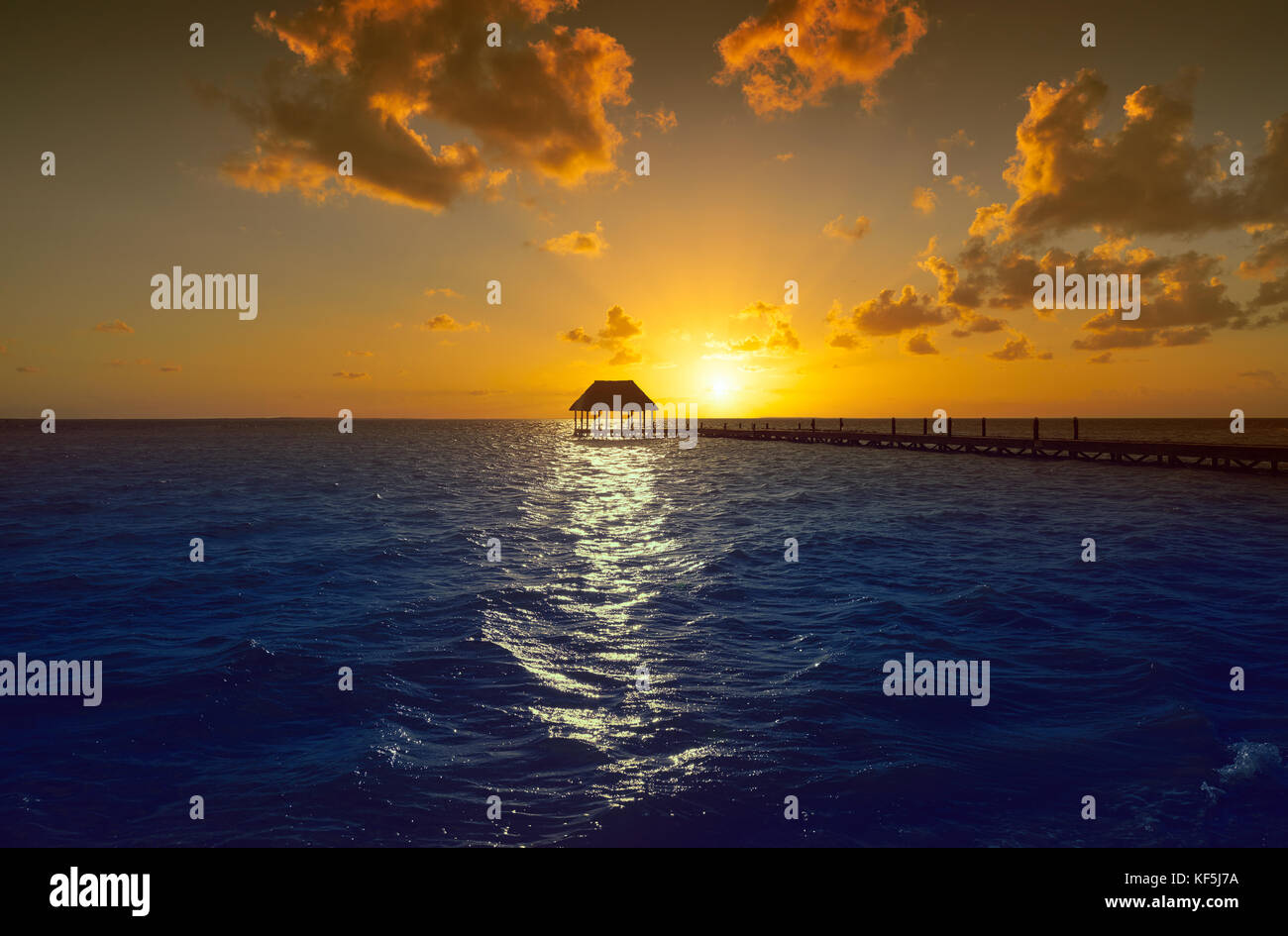 Holbox island sunset beach tropical hut pier in Mexico Stock Photo - Alamy