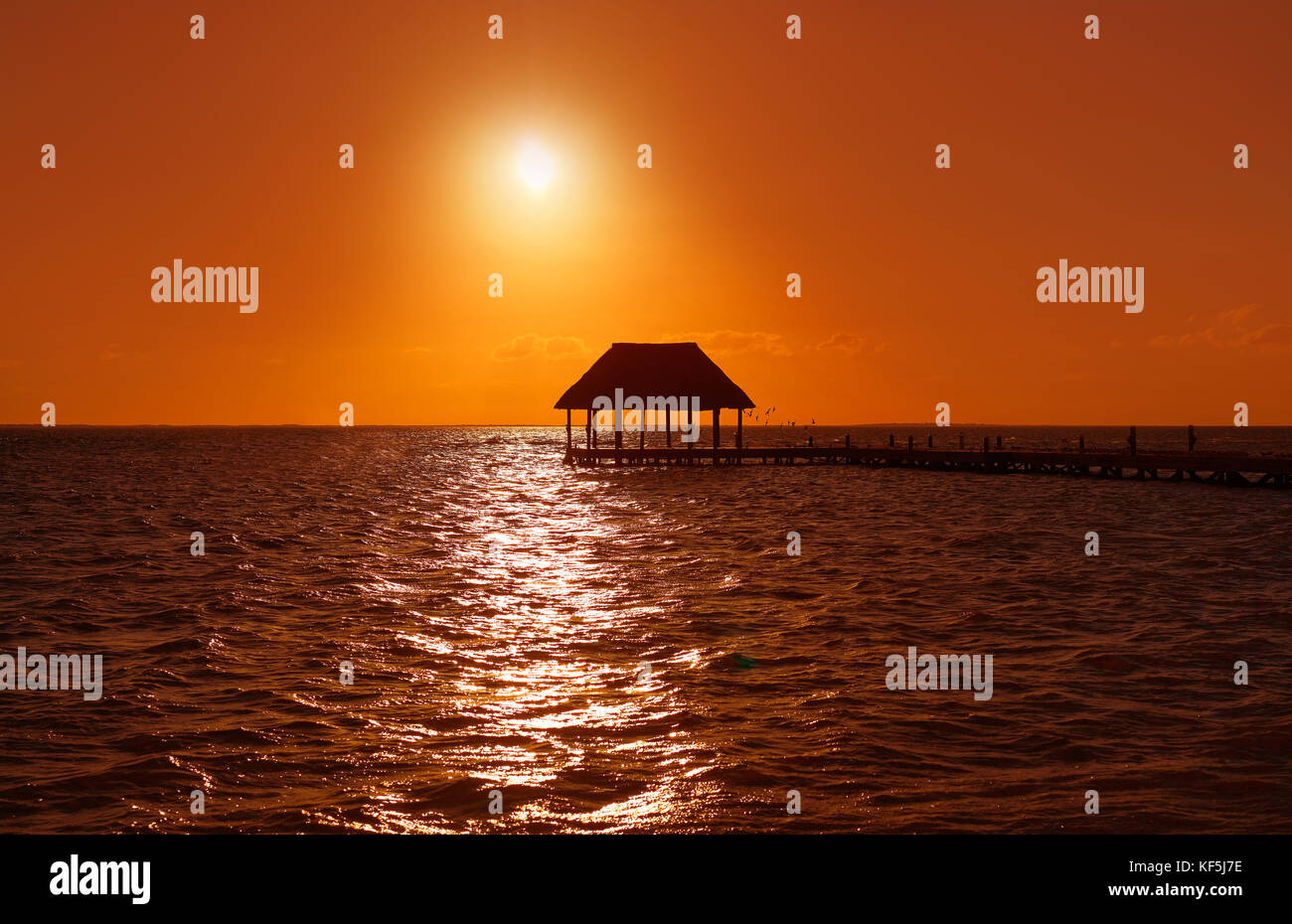 Holbox island sunset beach tropical hut pier in Mexico Stock Photo - Alamy