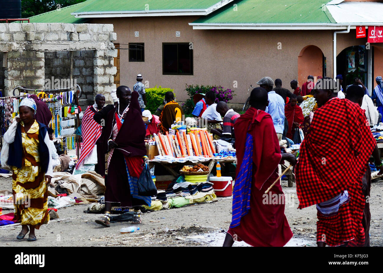 Maasai tribesmen in a colorful cattle and fresh produce market in ...