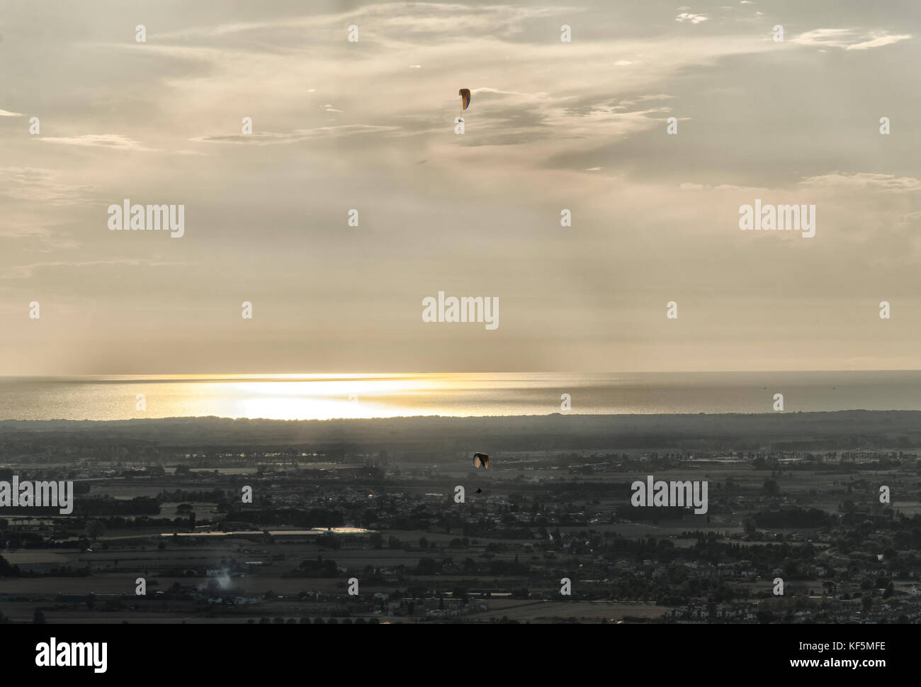 View of two paragliders at the sunset Stock Photo - Alamy