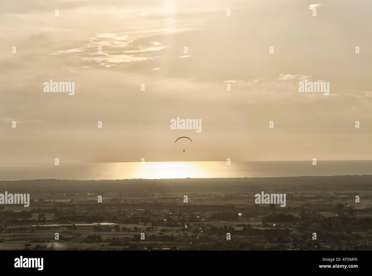 View of a paraglider in front of the sea Stock Photo - Alamy