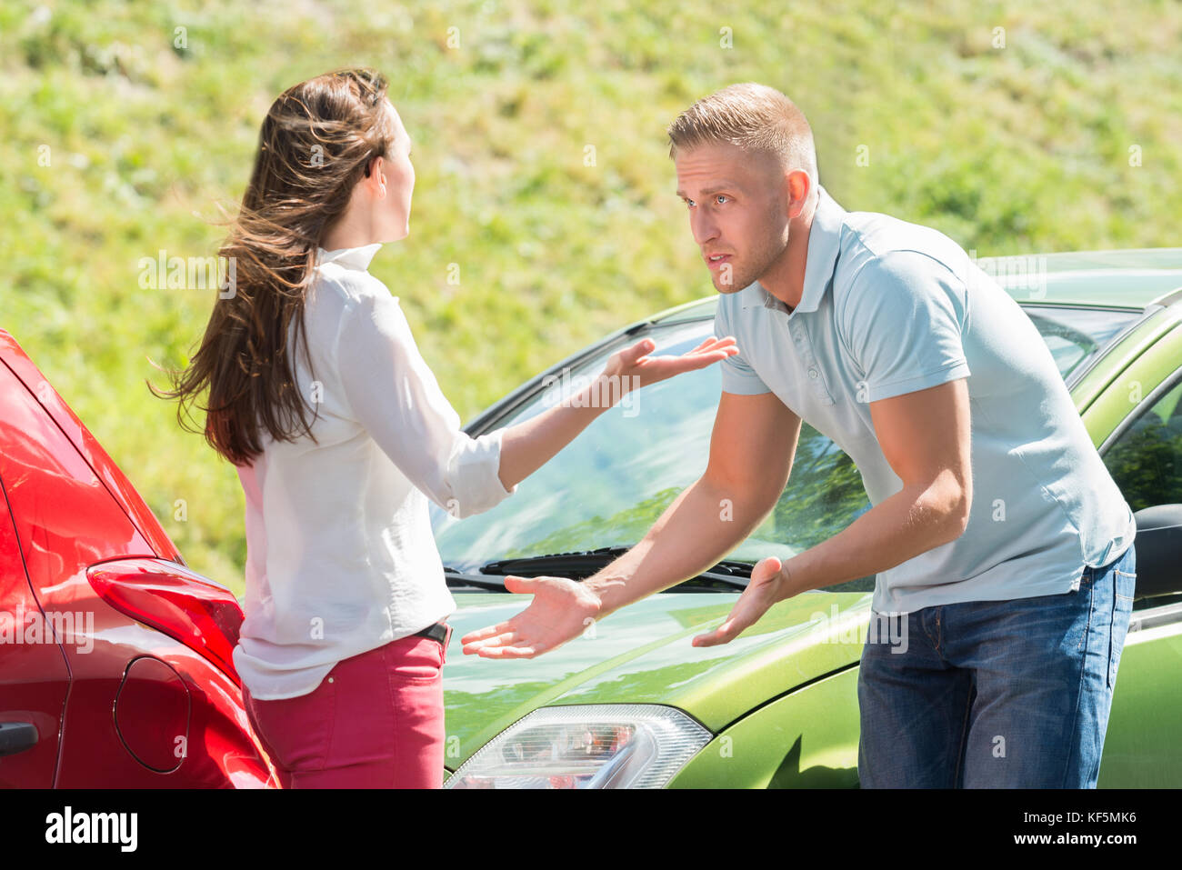 Unhappy Young Couple Arguing With Each Other On Street Stock Photo - Alamy