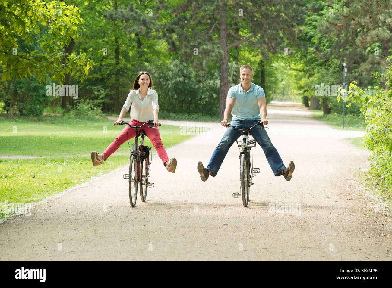 Couple man woman riding bicycle hi-res stock photography and images - Alamy
