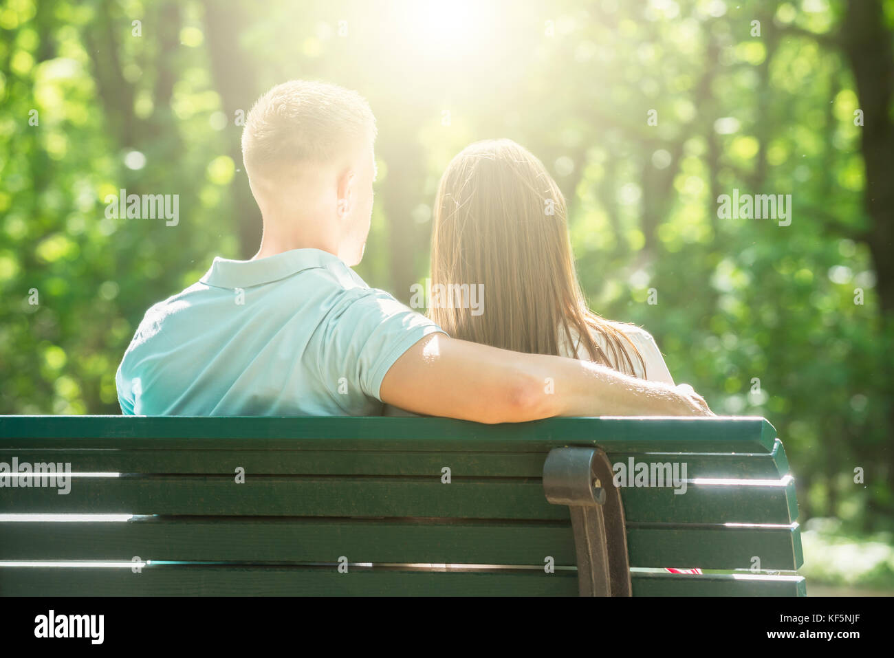 People family sitting on seat bench rear view hi-res stock photography ...