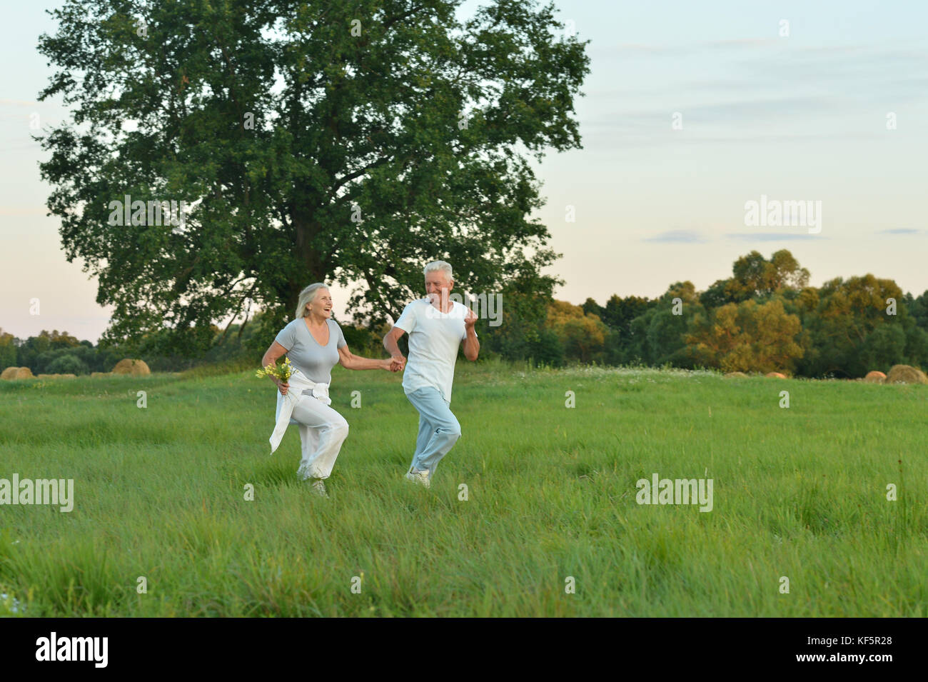 Beautiful couple running in hi-res stock photography and images - Alamy