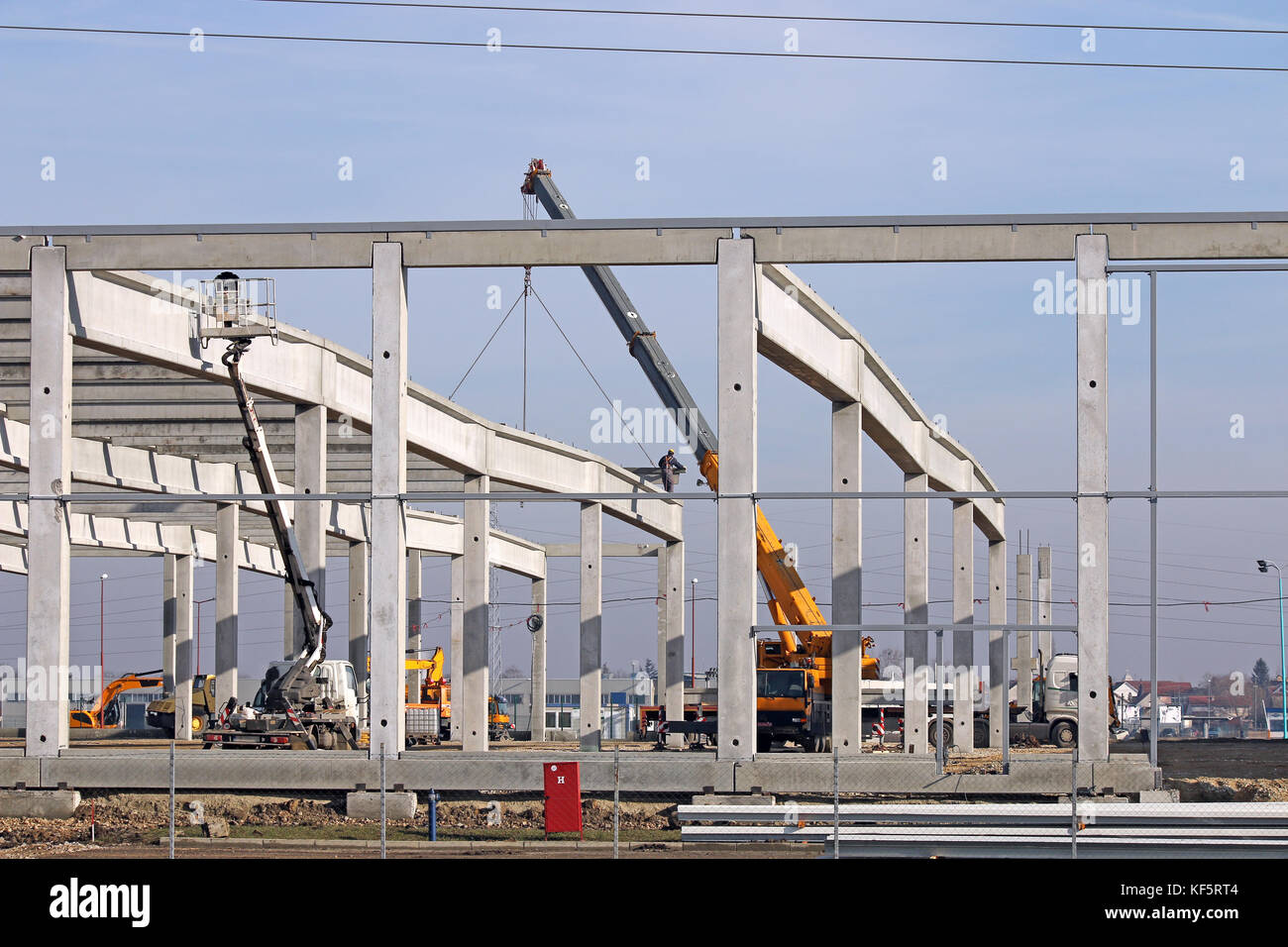 new factory construction site with workers and machinery Stock Photo ...