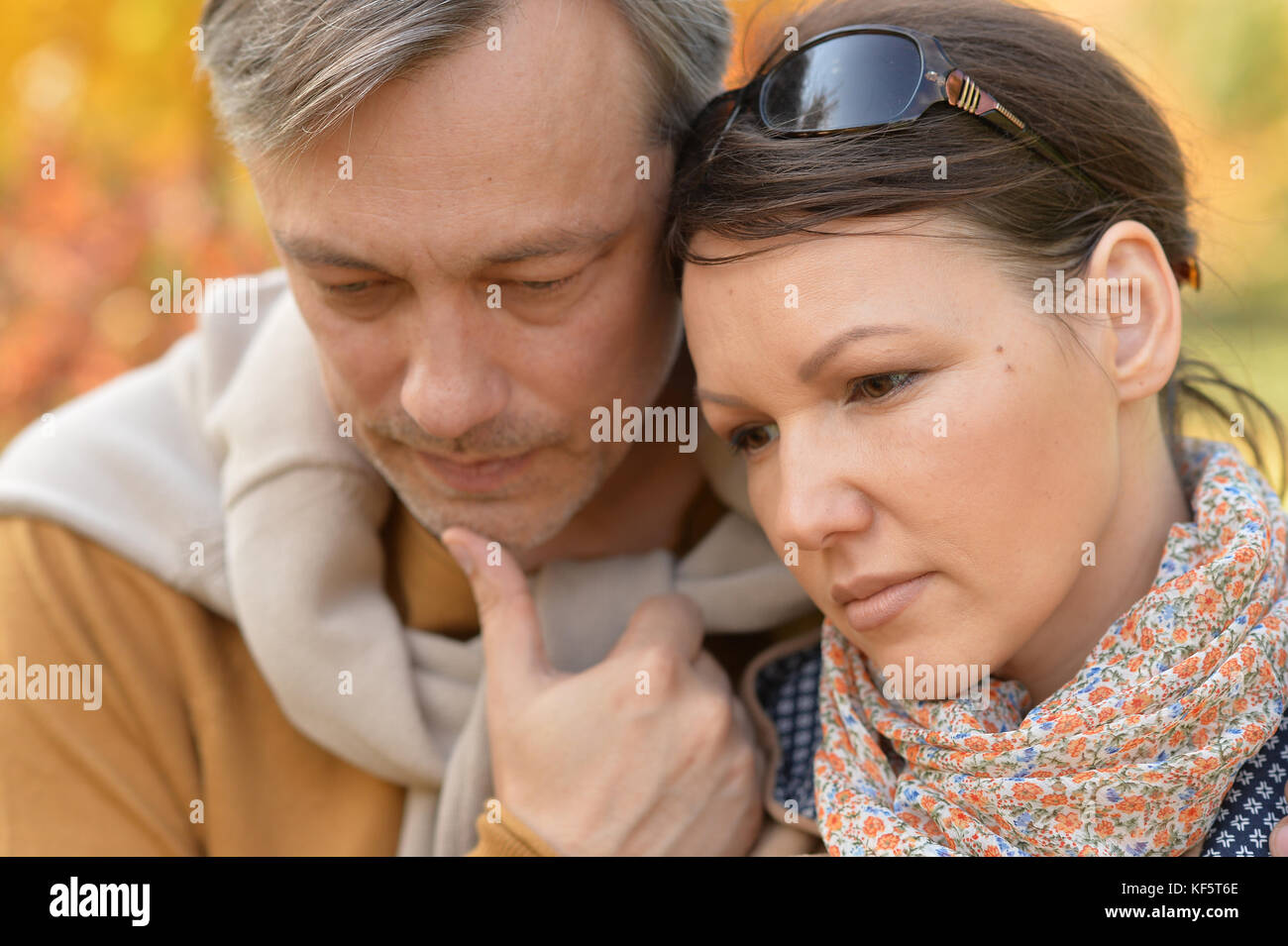 Sad couple posing Stock Photo - Alamy