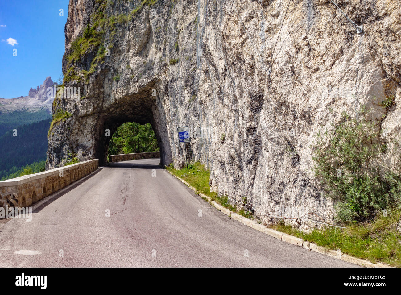 Mountain road and tunnel into the rocks Stock Photo - Alamy