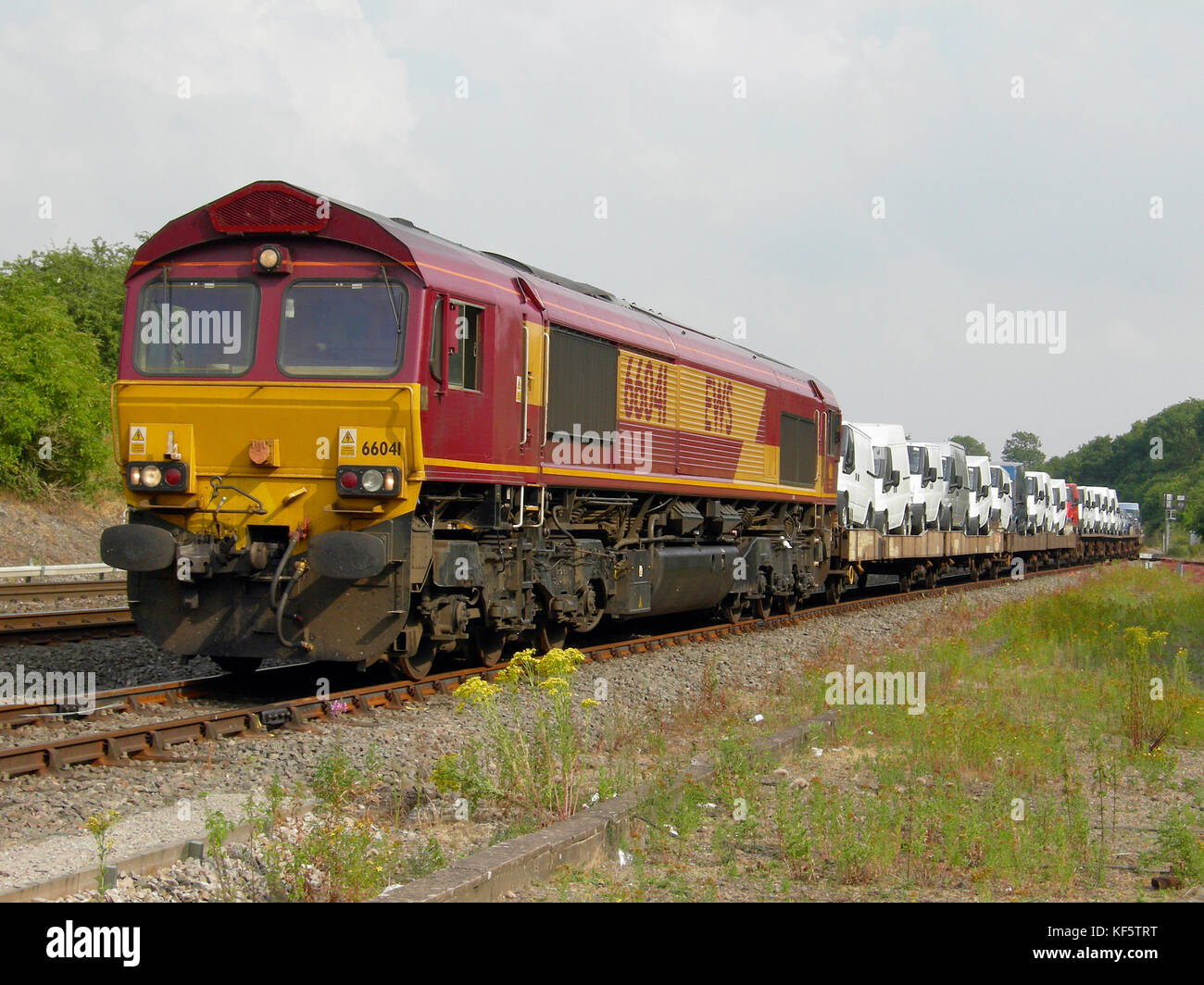 Class 66 locomotive on a freight train of Ford Transit vans Stock Photo ...