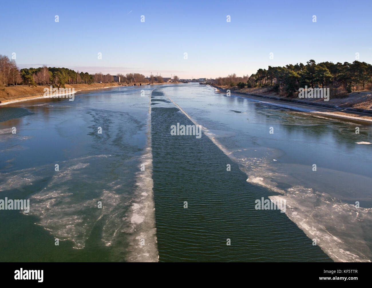 Channel in ice on way for ships Stock Photo - Alamy