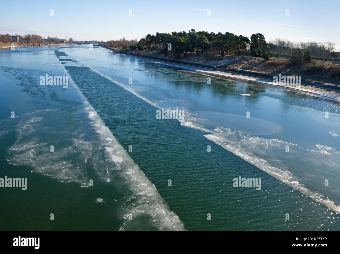 Channel in ice on way for ships Stock Photo - Alamy