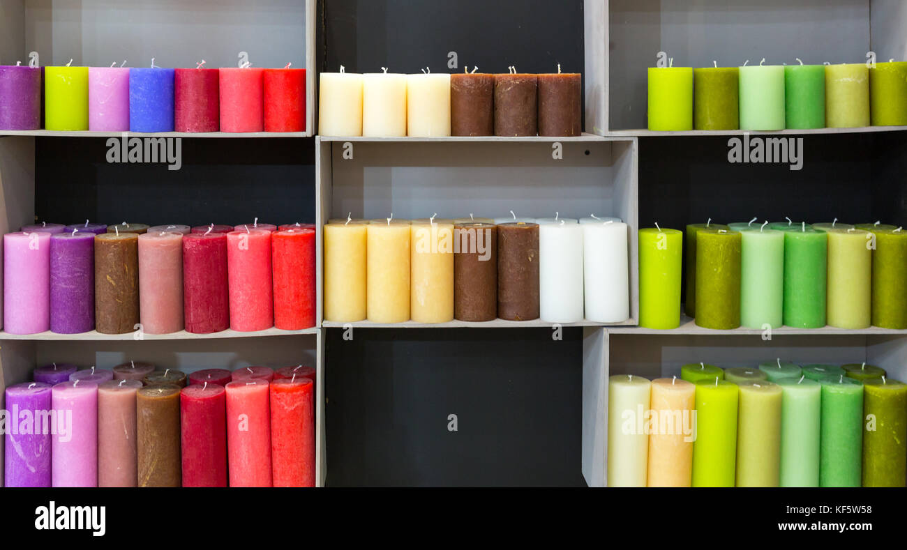 Colorful candles on shelf in decoration shop Stock Photo - Alamy