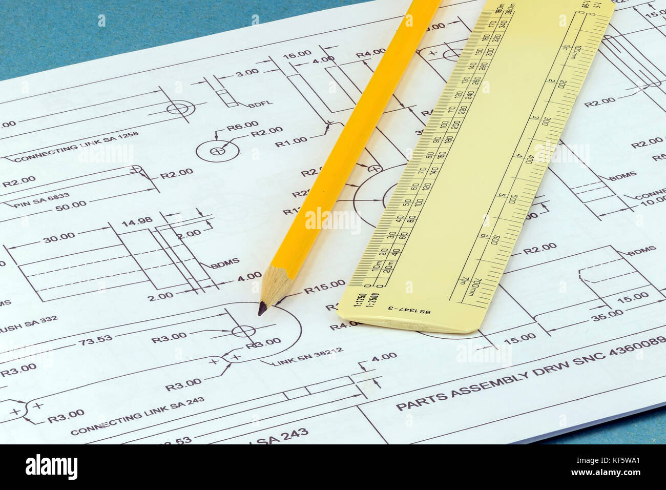 Pencil and scale ruler placed on an engineering drawing Stock Photo - Alamy
