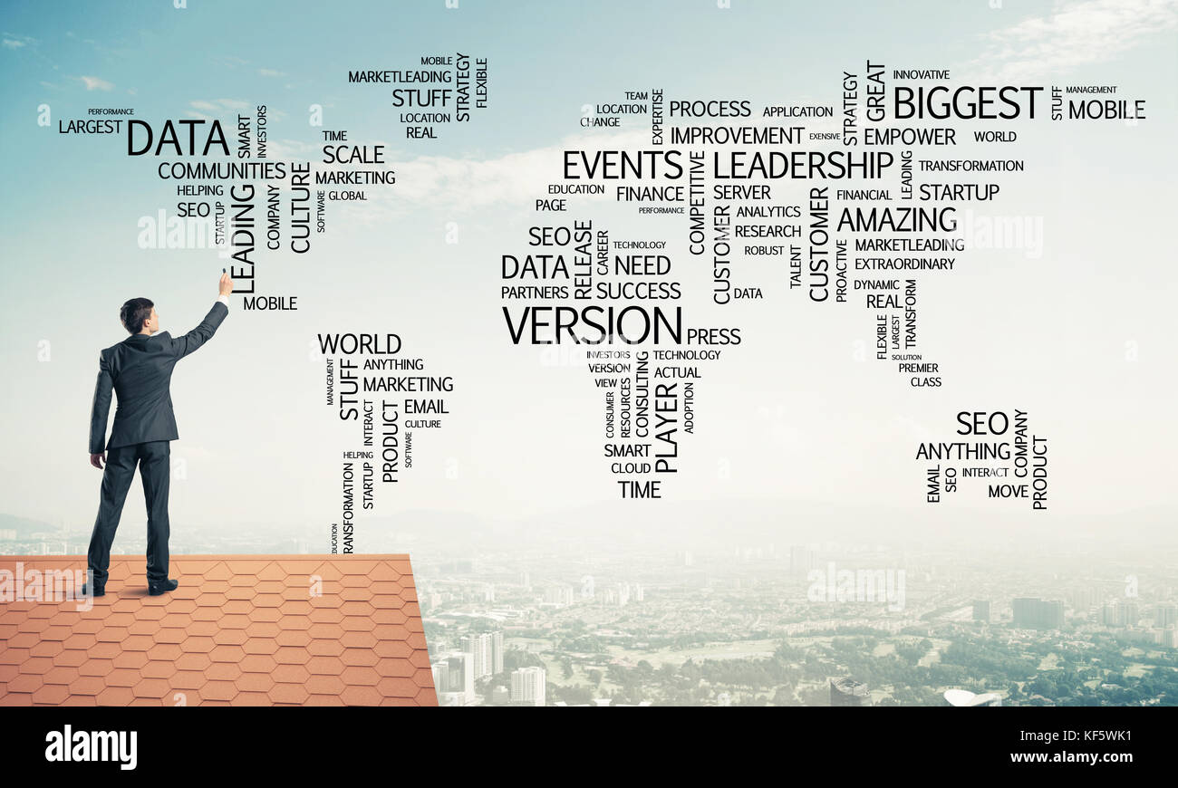 Businessman on brick roof draw world map as concept of globaliza Stock ...
