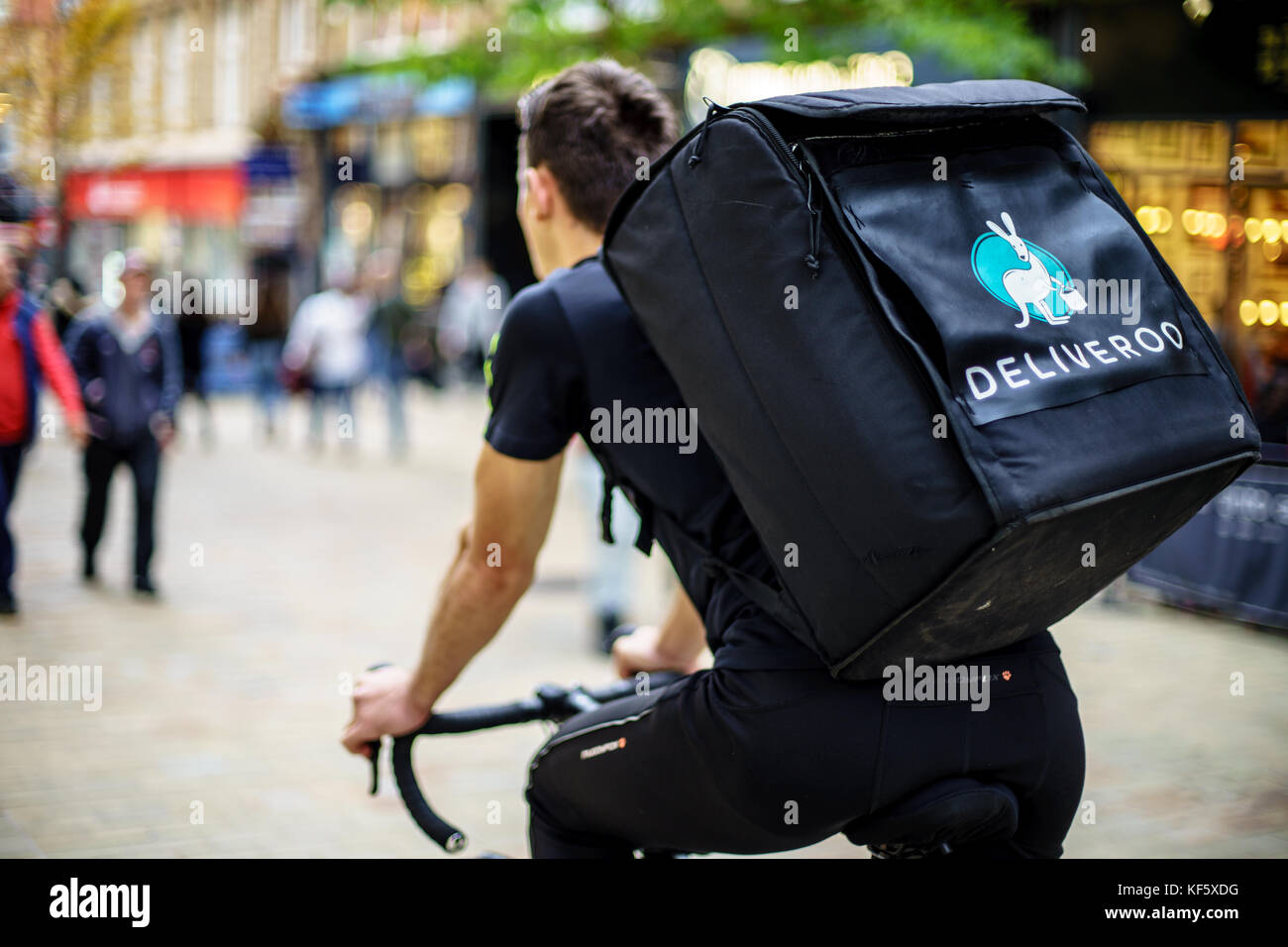 He is Deliveroo driver making transport of food, Order coming via ...