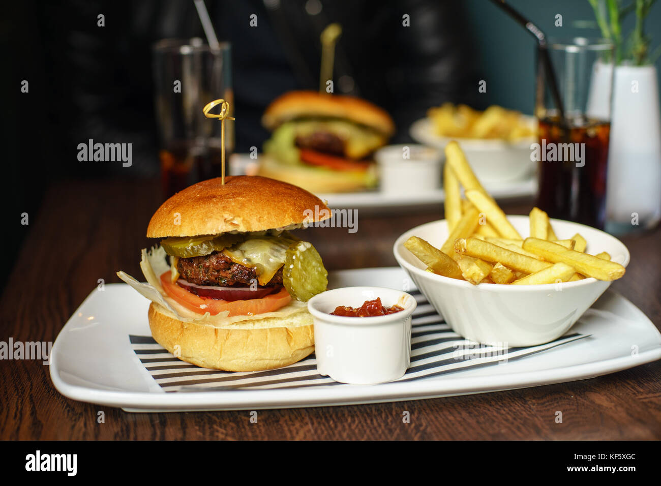 British Beef Burger with chips and coke Stock Photo - Alamy