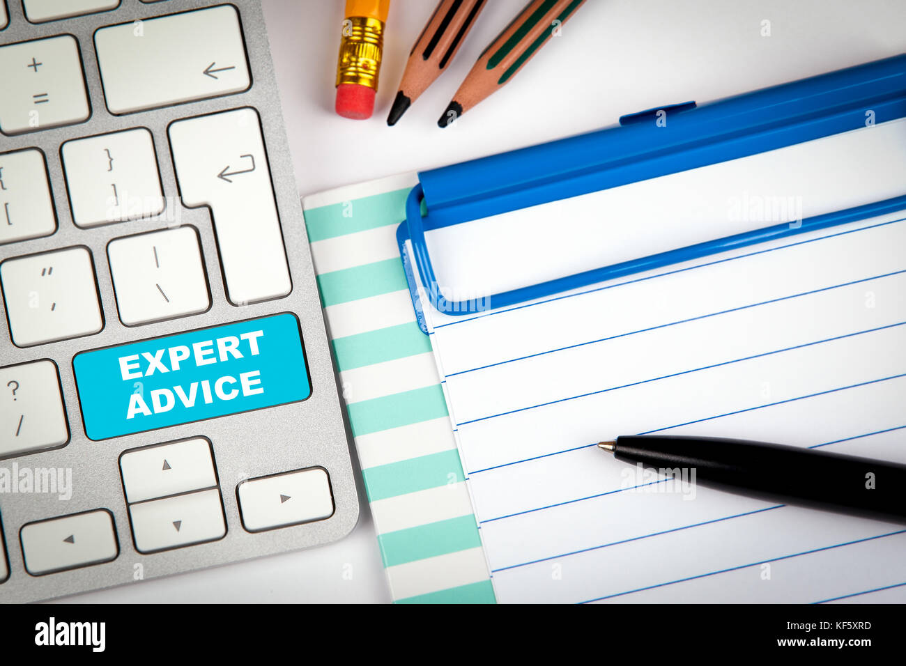 Expert Advice concept. Computer keyboard on a white office desk with ...