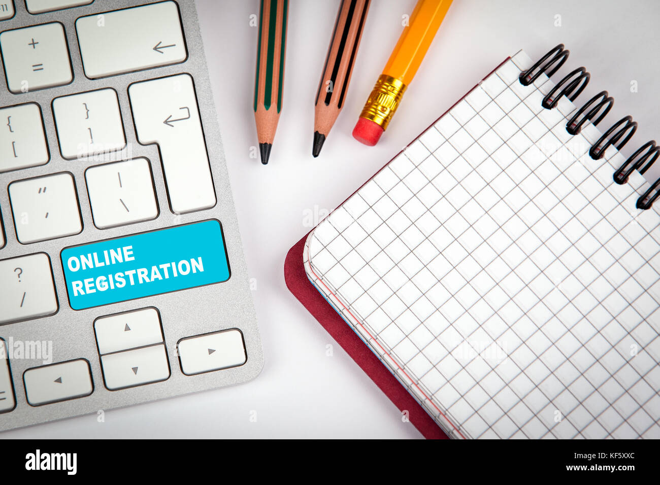Online Registration Concept. Computer keyboard on a white office desk ...
