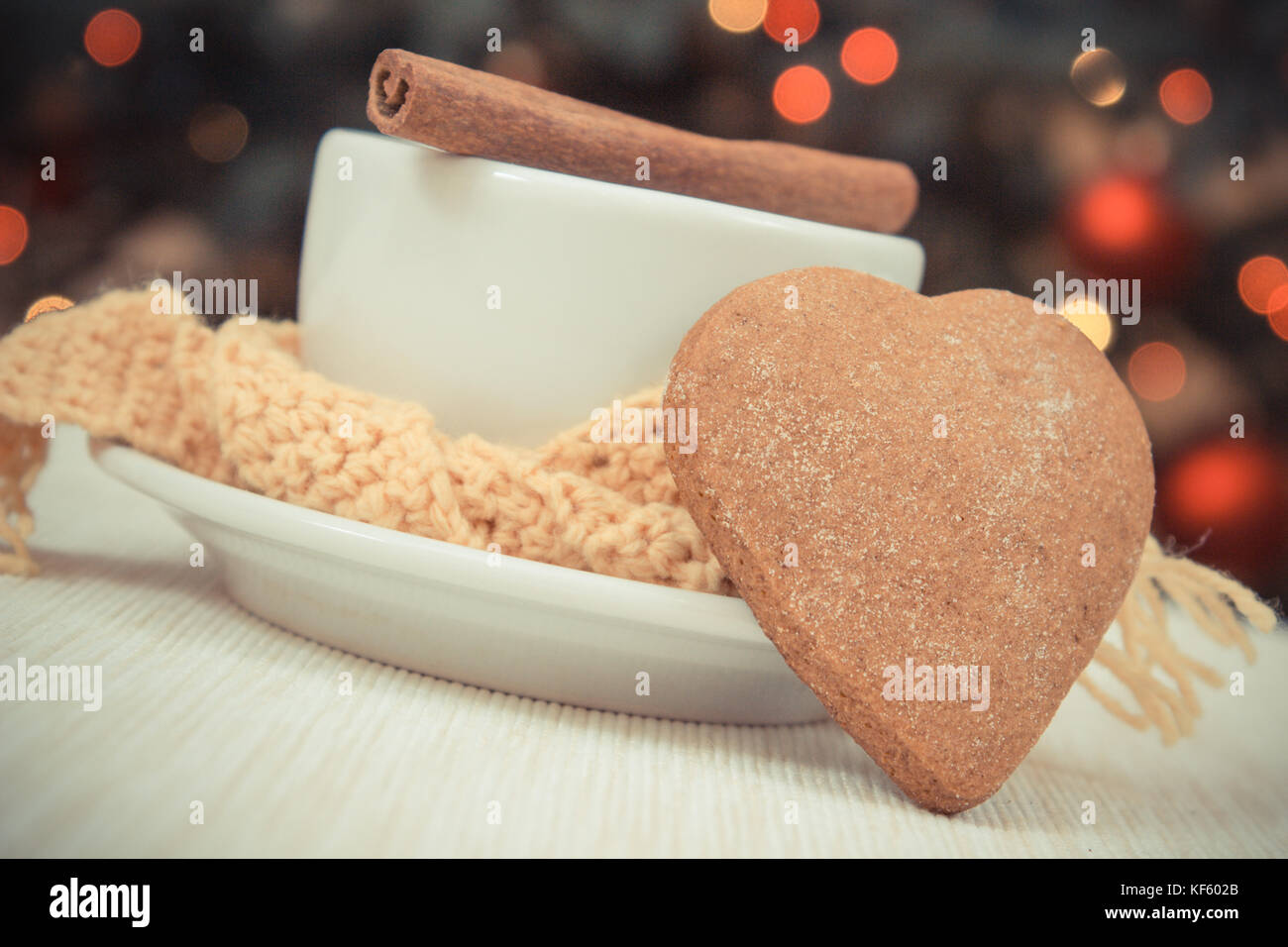 Vintage photo, Gingerbread, tea or coffee in white cup wrapped woolen ...