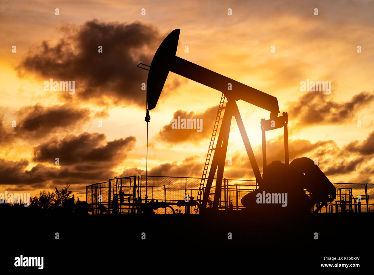 The oil pump, industrial equipment with sunset Stock Photo - Alamy