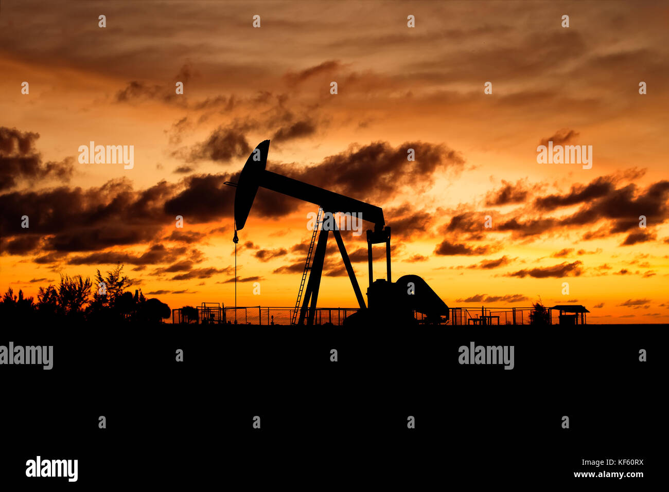 The oil pump, industrial equipment with sunset Stock Photo - Alamy