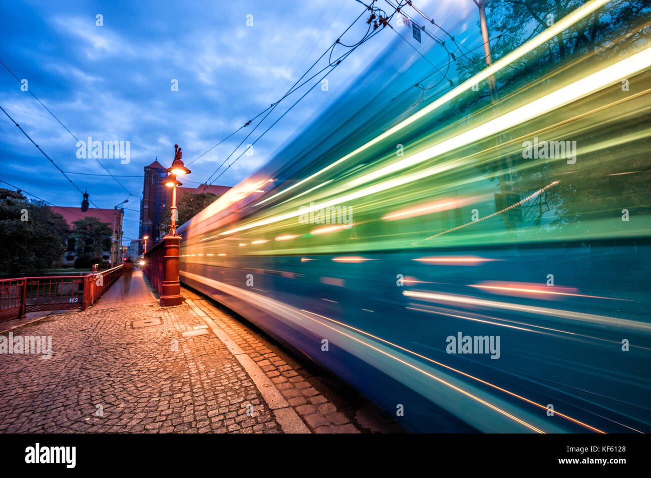 Fast moving tram blurred light trail Stock Photo - Alamy