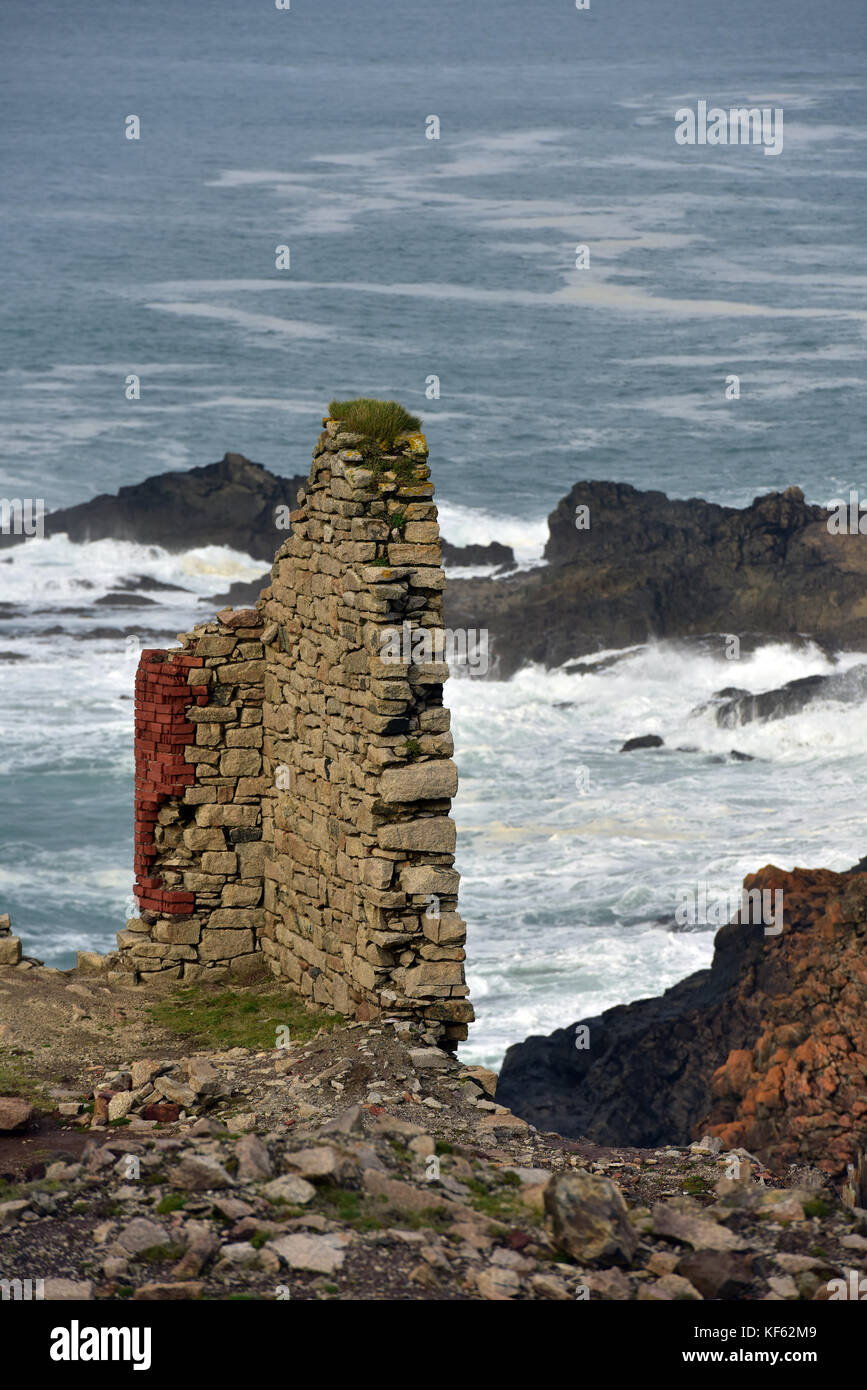 The ruins of an old disused engine house on the top of the cliffs in ...
