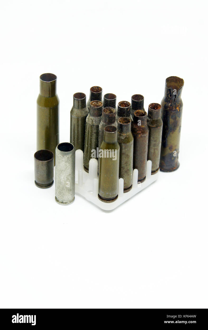 several shell casings and bullet on white background Stock Photo - Alamy