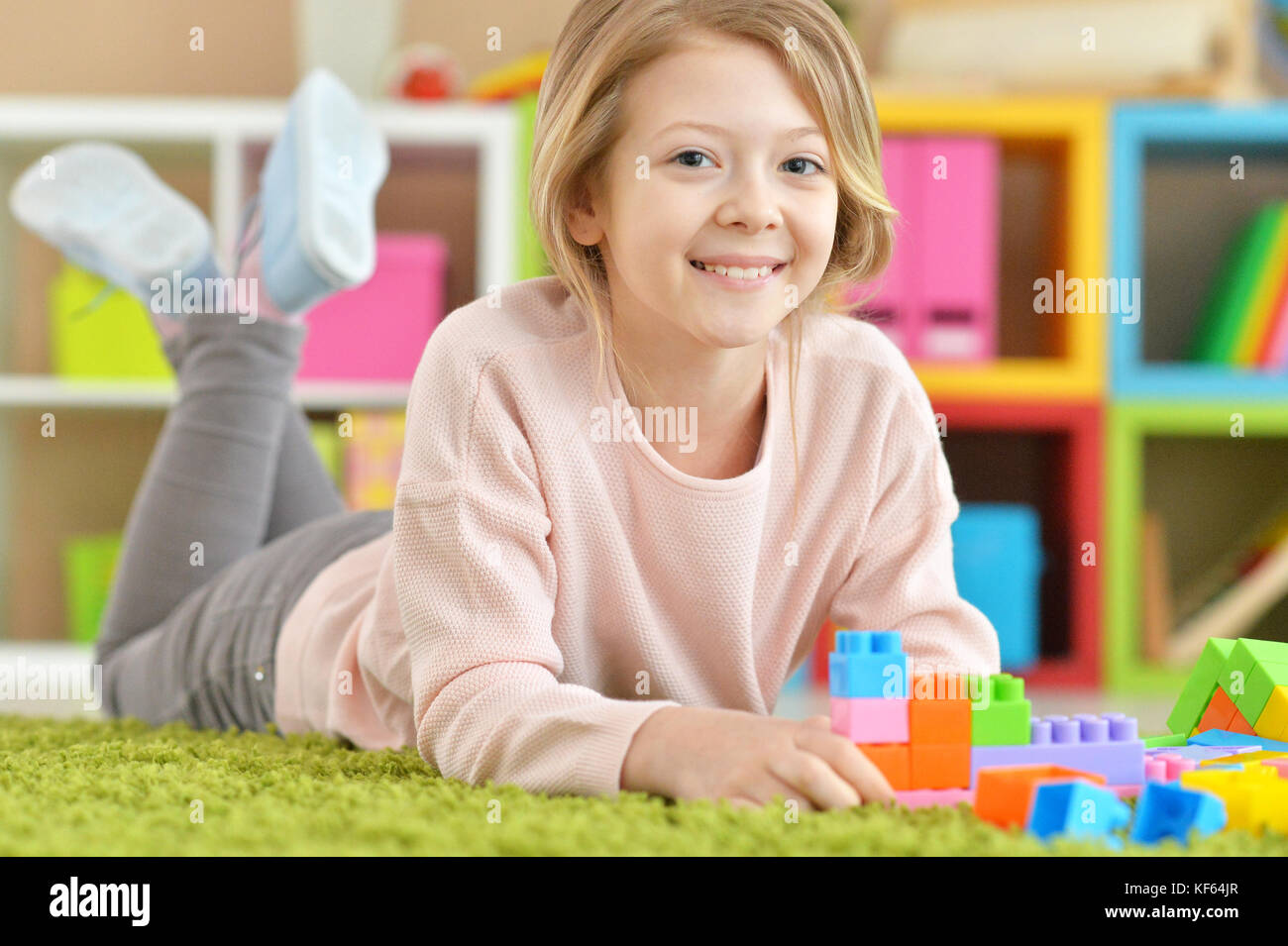 girl playing with plastic blocks Stock Photo - Alamy
