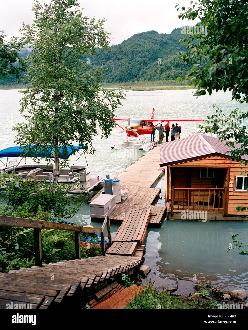 USA, Alaska, cabins and a float plane by the dock at the Redoubt Bay ...