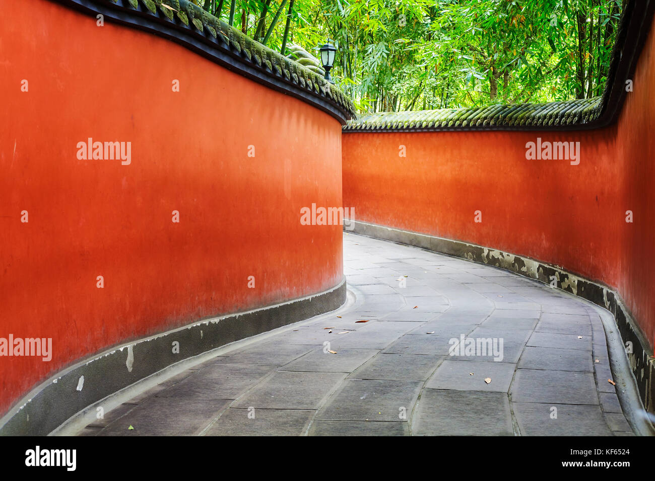 Curvy red walls passage surrounded by bamboo forest, Wuhou Temple in ...
