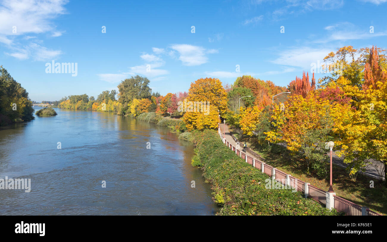 The Willamette River flows beside a bike path in Eugene, Oregon Stock ...