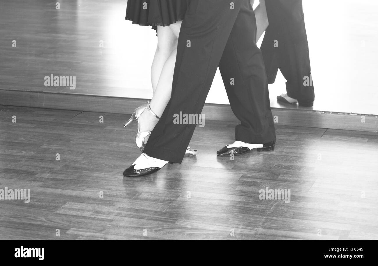 Ballroom dance couple of dancers and teachers in studio school dancing ...