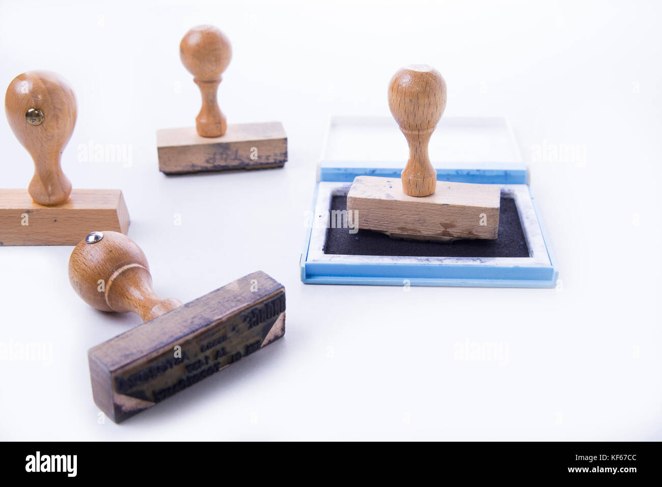 Four old rubber stamp with pad on white background Stock Photo - Alamy