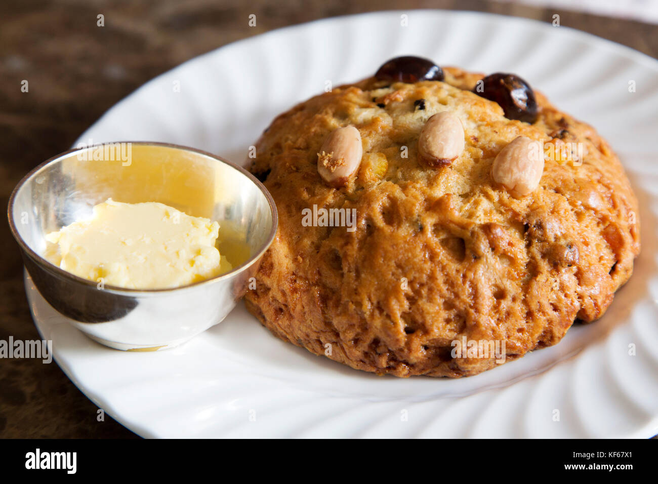 A Yorkshire Fat Rascal served with butter at Bettys Cafe Tea Room in ...