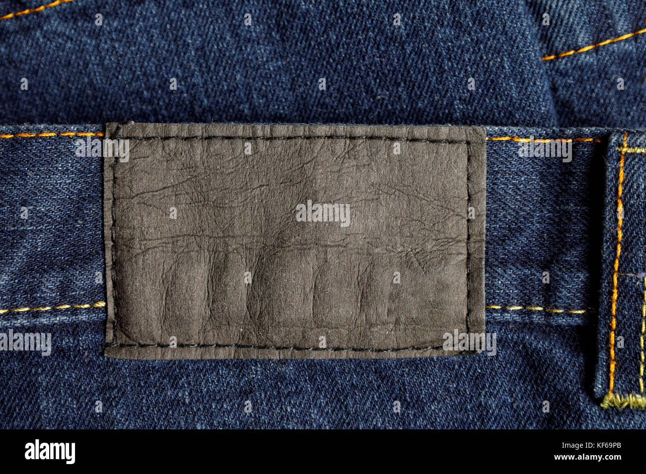 blue jeans texture with the blank brown tab Stock Photo - Alamy