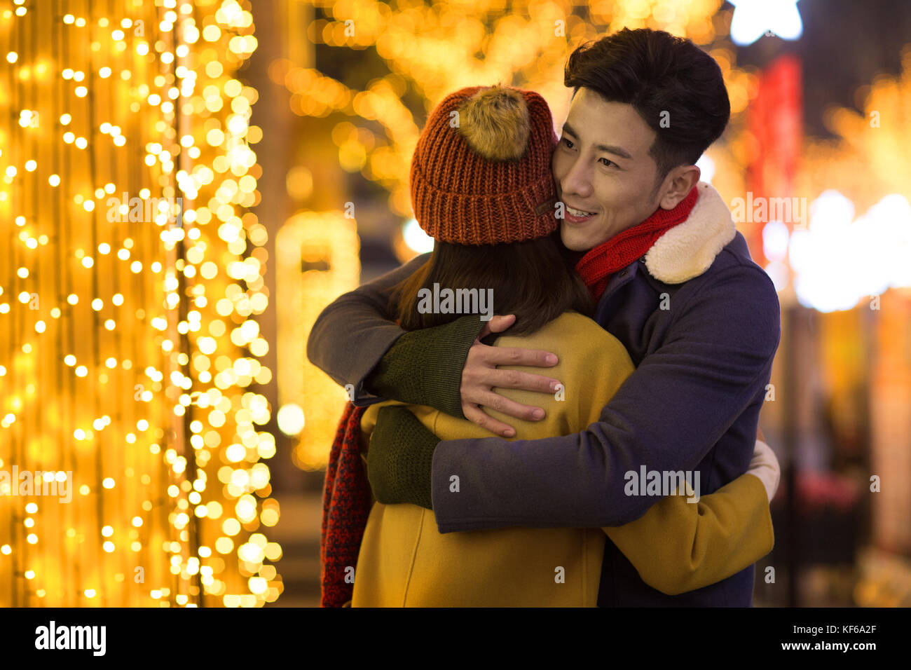 Happy couples hug Stock Photo - Alamy