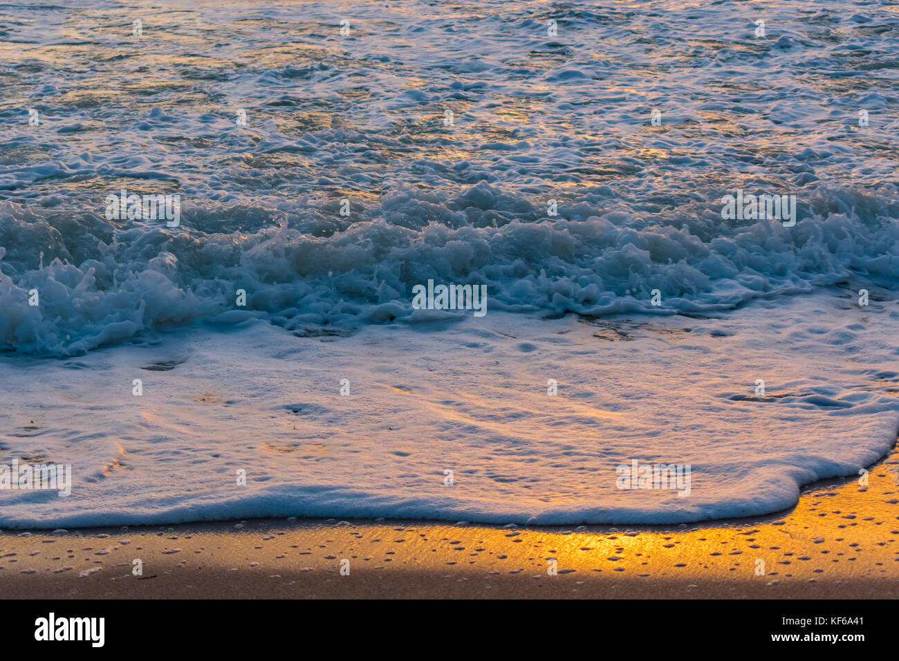 background water texture - sunrise colors reflection off a wave and is ...